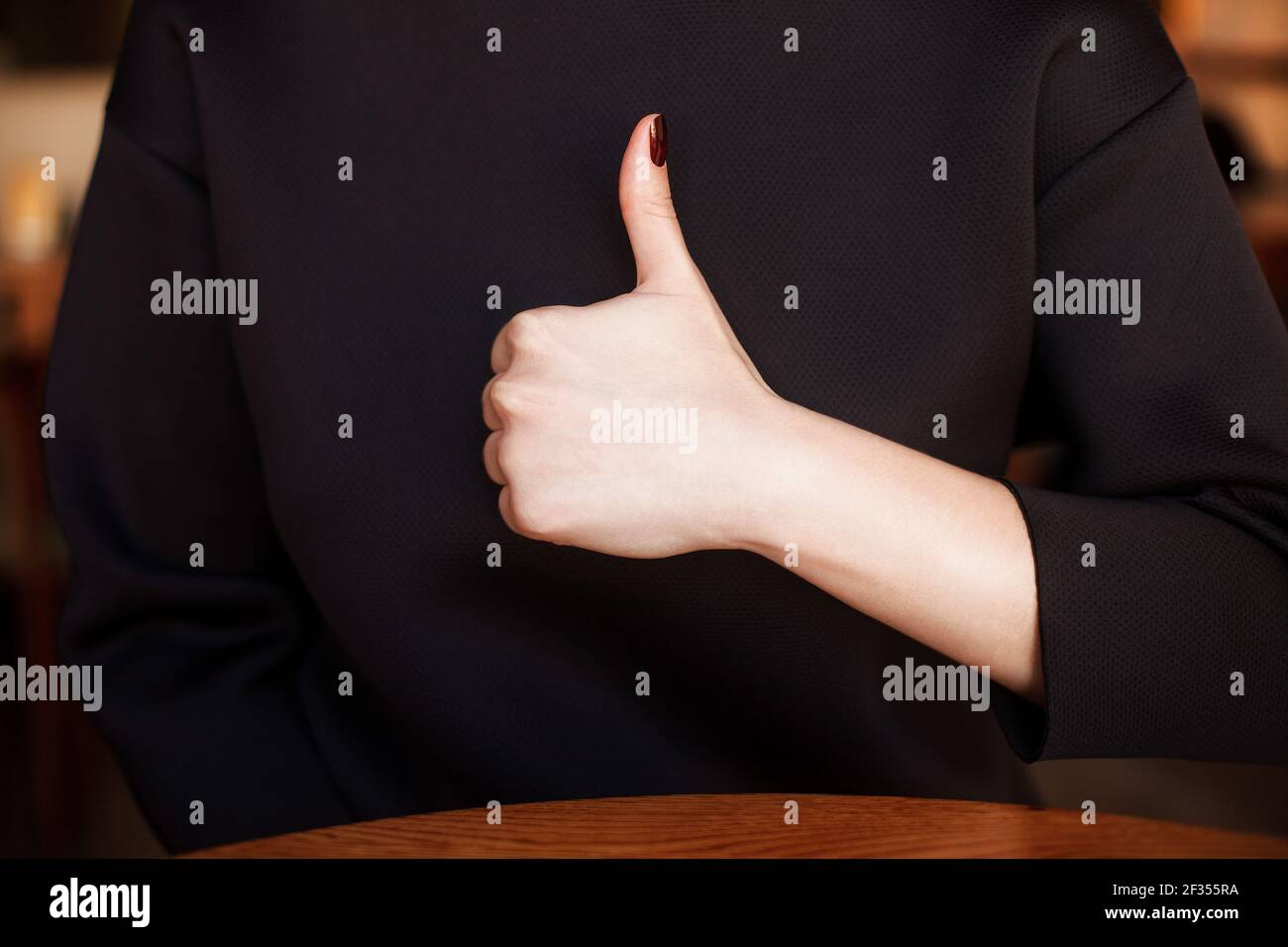 female hand showing thumbs up sign Stock Photo - Alamy