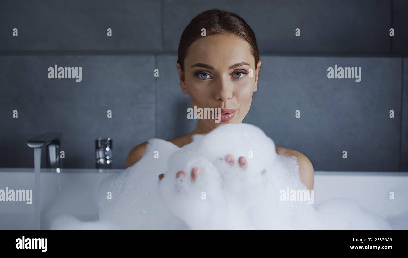 Woman bath blow bubbles hi-res stock photography and images - Alamy
