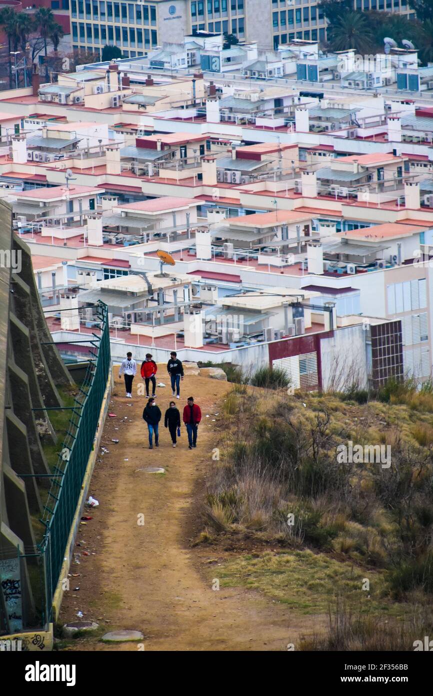 People walking in a path of a park. Buildings background Stock Photo ...