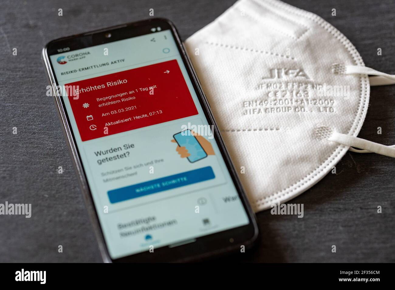 BERLIN, GERMANY - Mar 13, 2021: Corona Warn App red alert warning ...