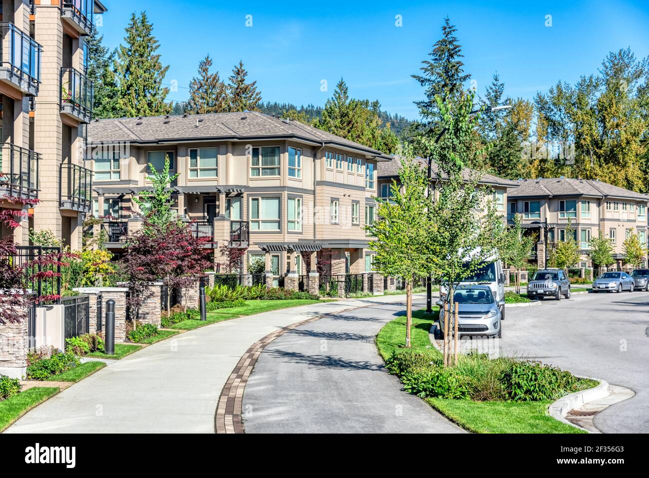 Paved pathway along residential building on sunny day Stock Photo - Alamy