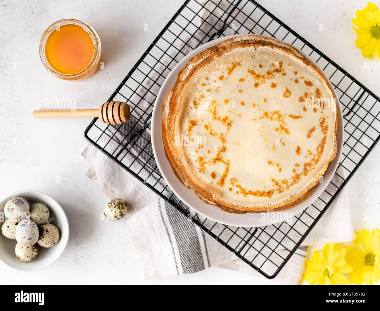 stack of hot Russian pancakes blini with honey. Russian Traditional ...