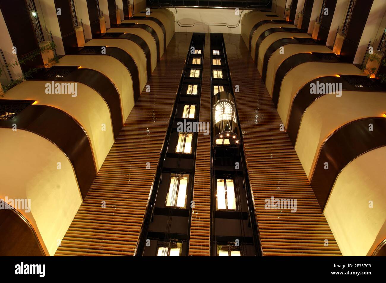 Elevators in atrium of hotel/convention center Stock Photo - Alamy