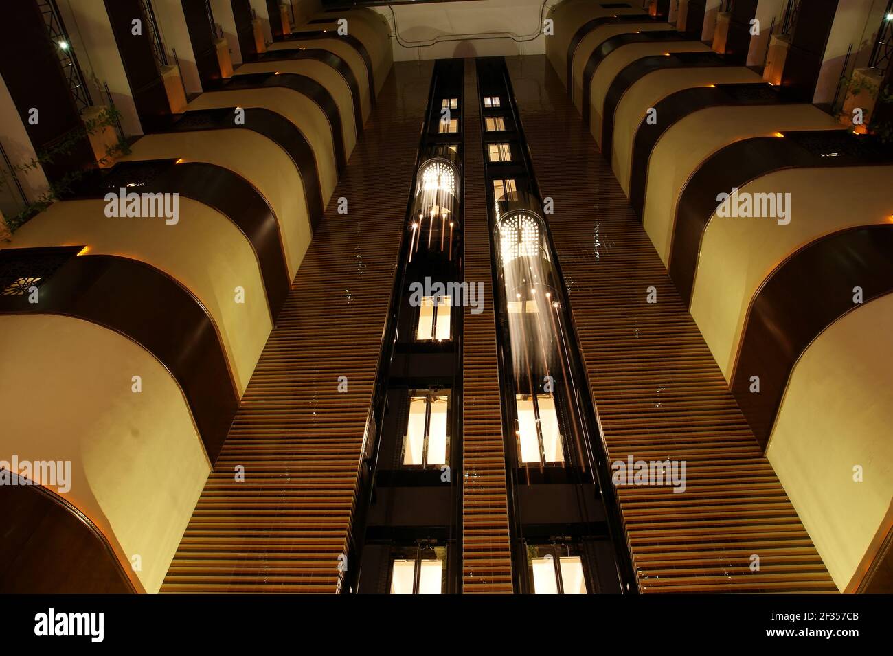 Elevators in atrium of hotel/convention center Stock Photo - Alamy