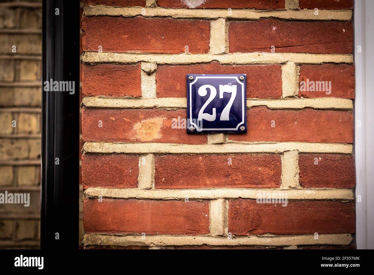 House number 27 on a brick wall Stock Photo - Alamy
