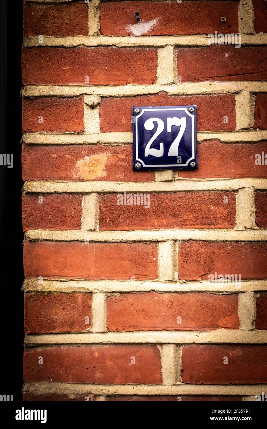 House number 27 on a brick wall Stock Photo - Alamy