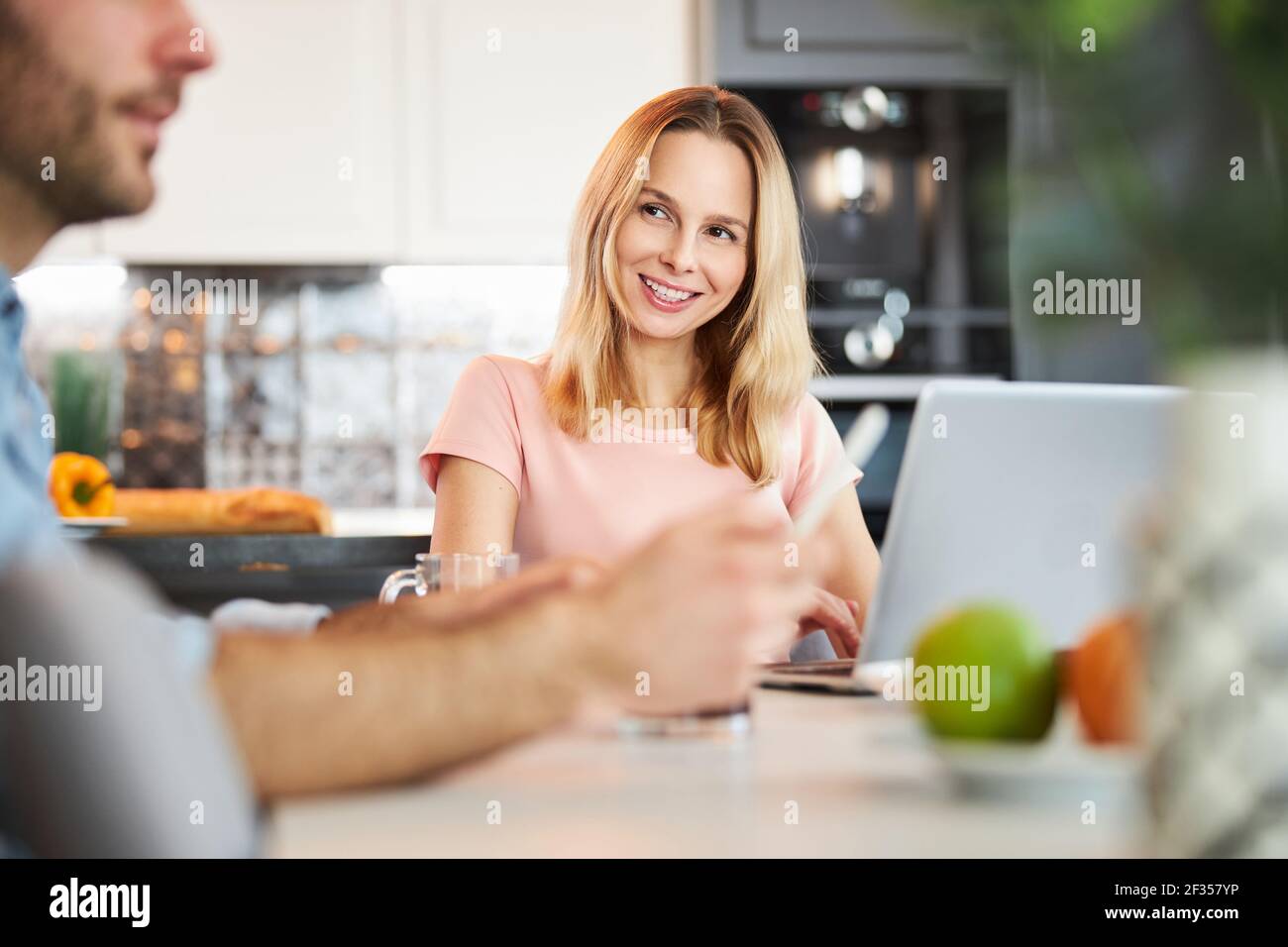 Cheerful woman spending time with husband at home Stock Photo - Alamy