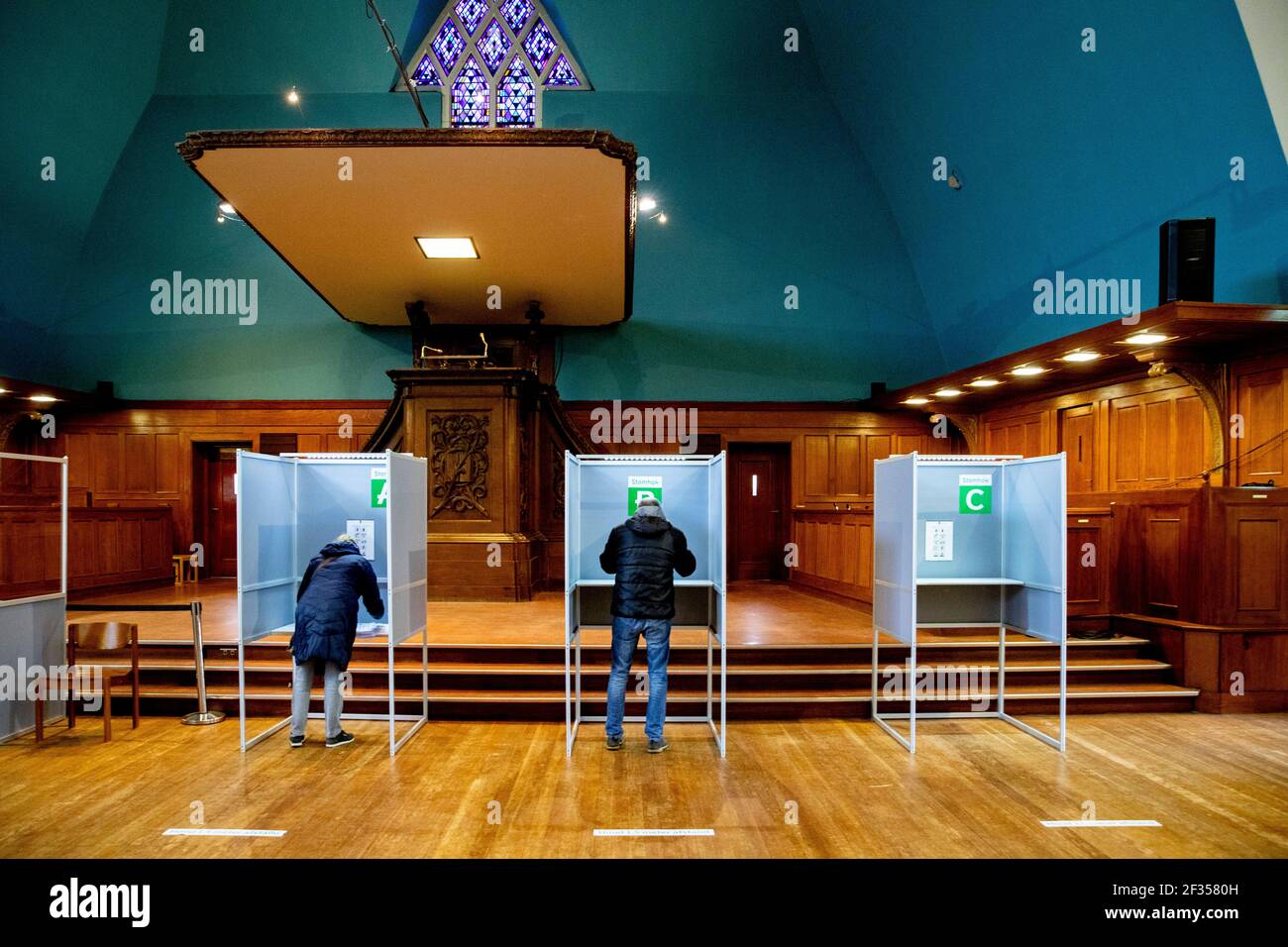 ROTTERDAM, NETHERLANDS - MARCH 15: People are seen voting at a polling ...