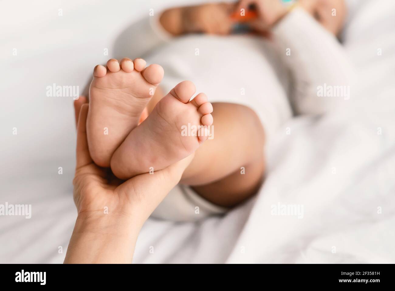 Closeup of cute little African American baby's feet Stock Photo - Alamy