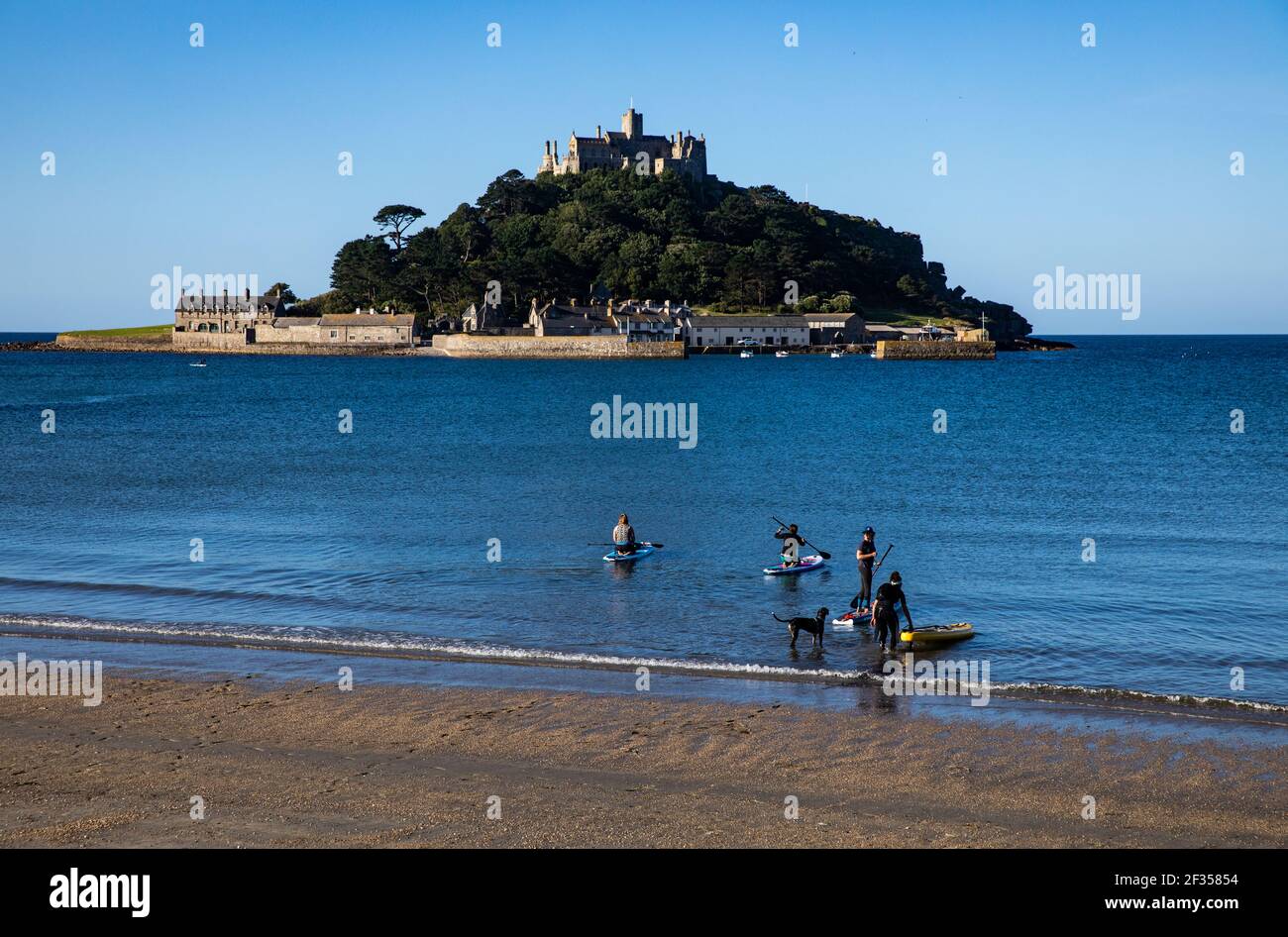 Local swimmer Jan during a swim around Saint Michael's Mount at sunrise ...