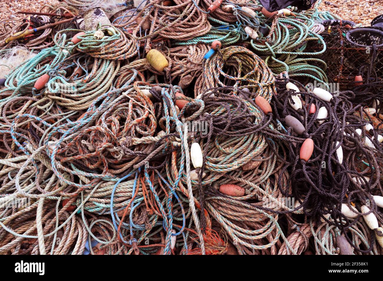Tangled pile of ropes and floats Stock Photo - Alamy