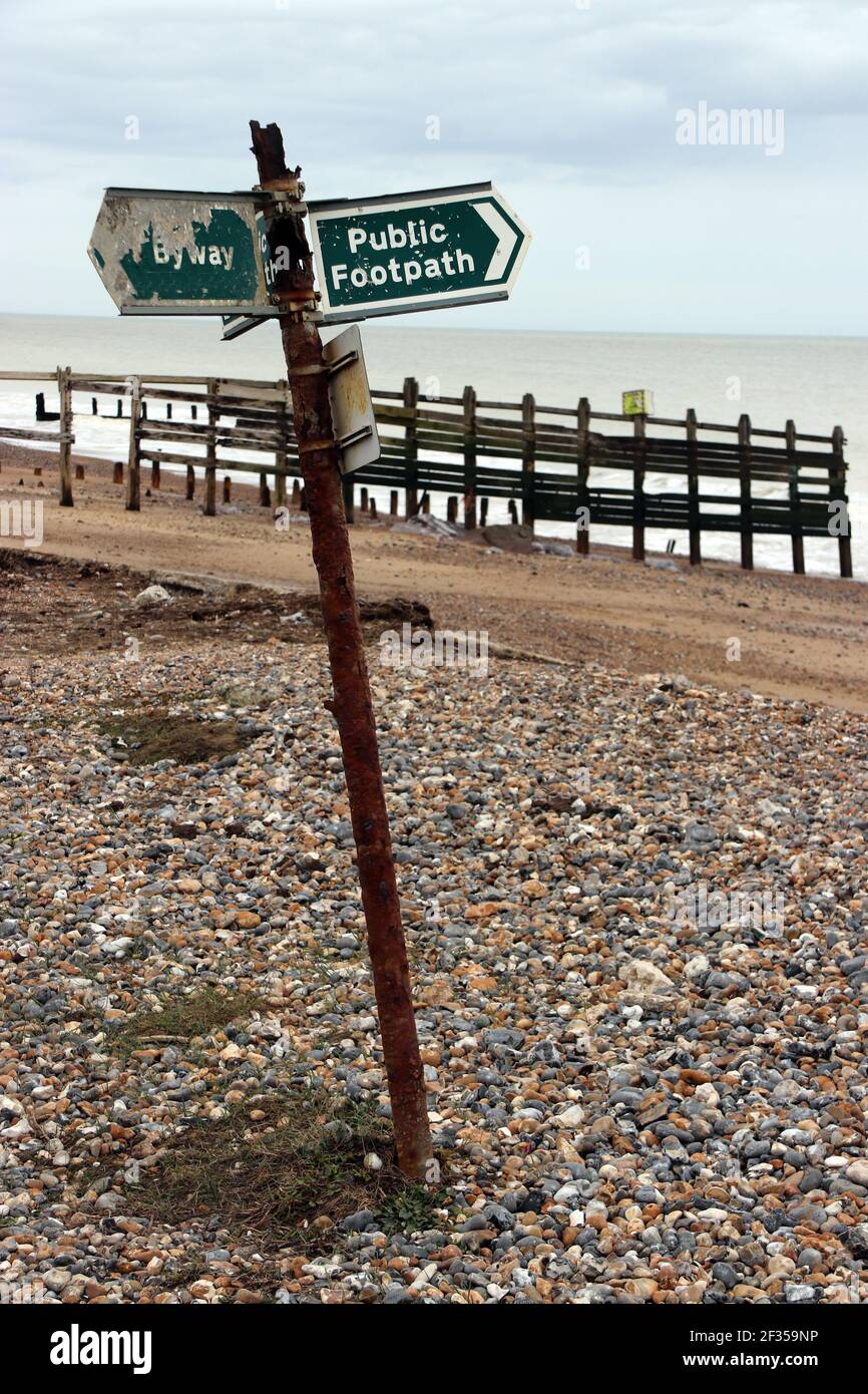 Public Footpath sign in Sussex pointing into the sea , England, UK ...