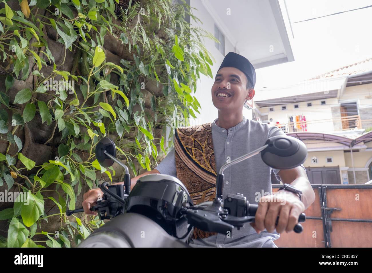 Muslim riding motorcycle hi-res stock photography and images - Alamy