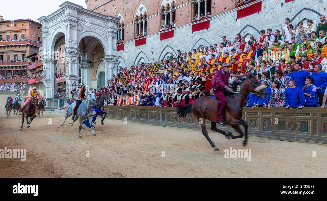 The Palio di Siena horse race on Piazza del Campo, Siena, Tuscany ...