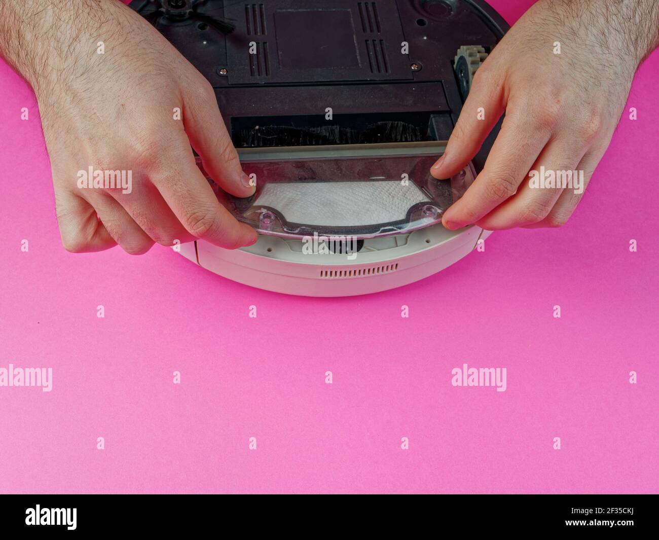 The robot vacuum cleaner is disassembled, the vacuum cleaner is being ...