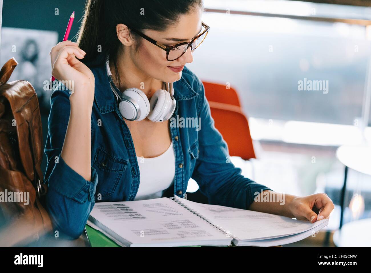 Pretty young college student studying, preparing for exam Stock Photo ...