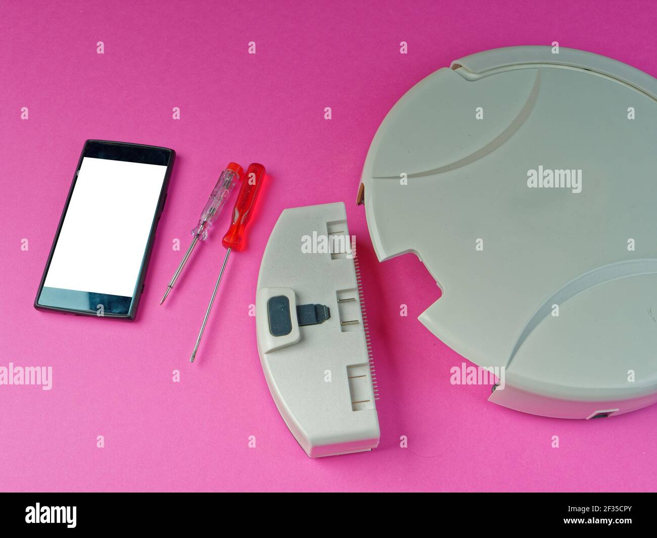 The robot vacuum cleaner is disassembled, the vacuum cleaner is being ...