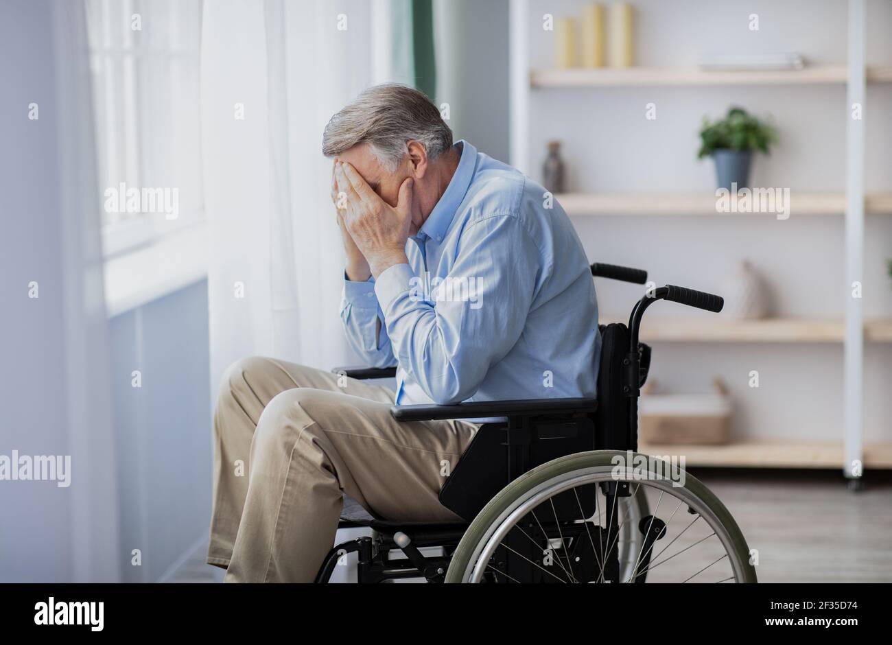 Depression and loneliness in disabled seniors. Elderly man in ...