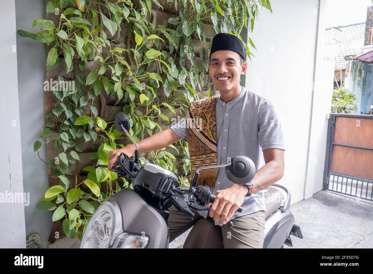 Muslim riding motorcycle hi-res stock photography and images - Alamy