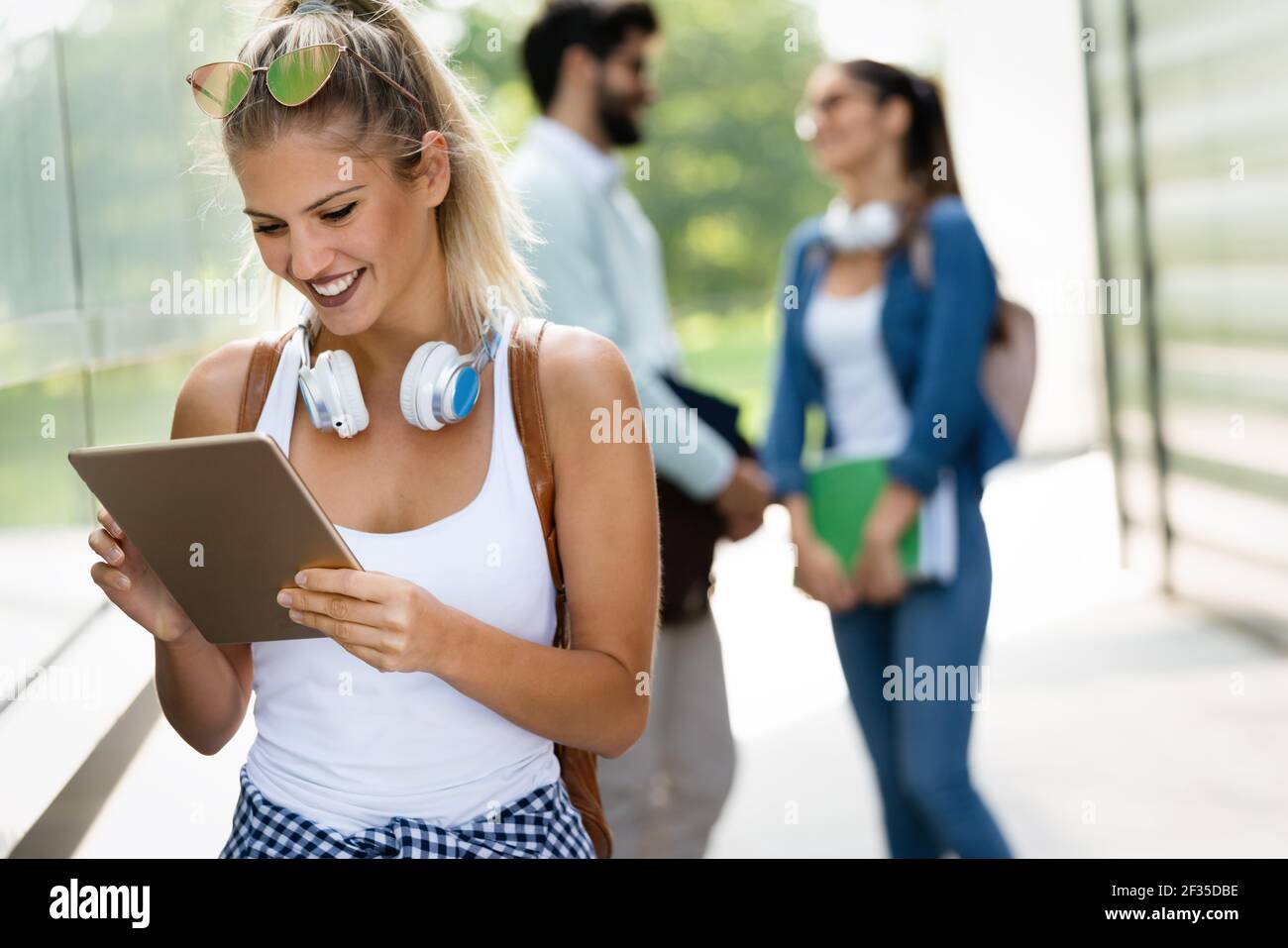 Happy friends with books having fun while studying. Friendship, study ...