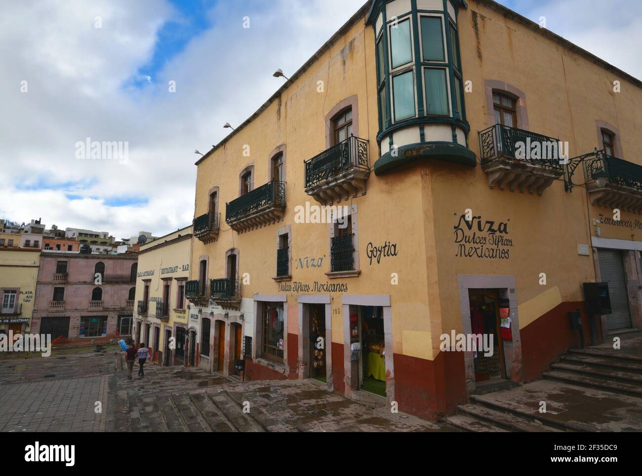 Colonial style commercial buildings and local shops on Avenida Hidalgo ...
