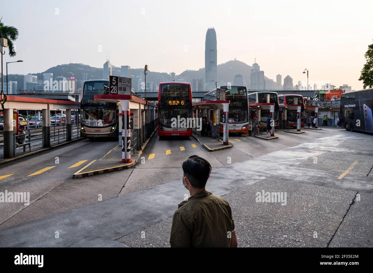 A commuter is seen walking towards the bus station near the Victoria ...