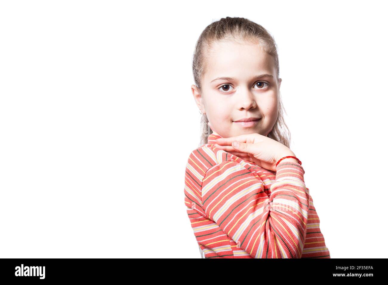 Beautiful and feminine first grader girl isolate on a white with copy ...