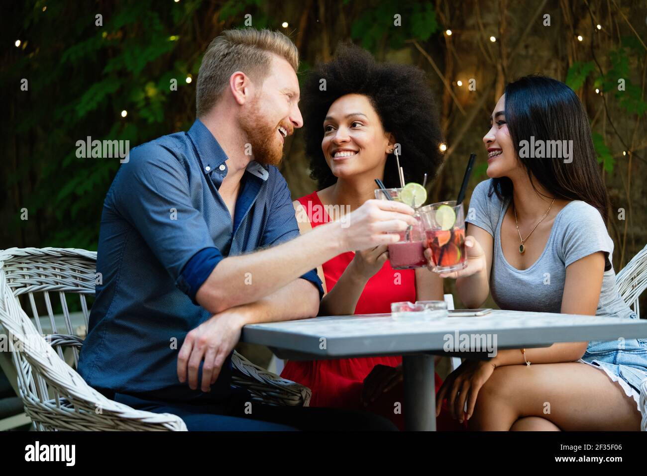 Group of friends having fun together. People talking laughing and ...