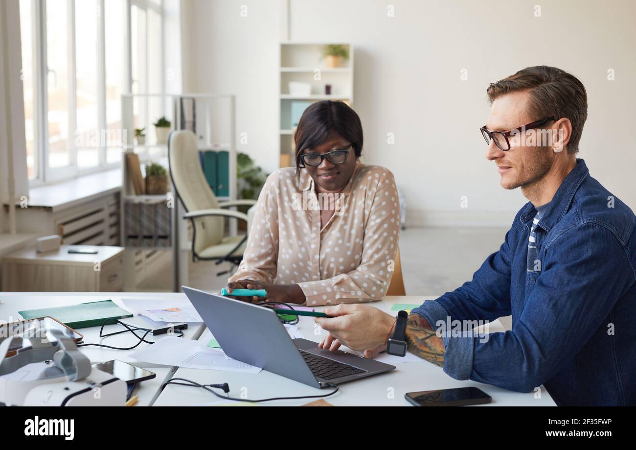 Portrait two developers pointing hi-res stock photography and images ...