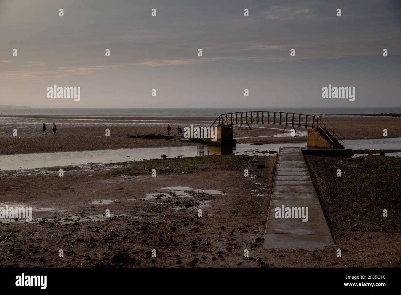 A member of the public walking towards Belhaven Bridge in Dunbar ...