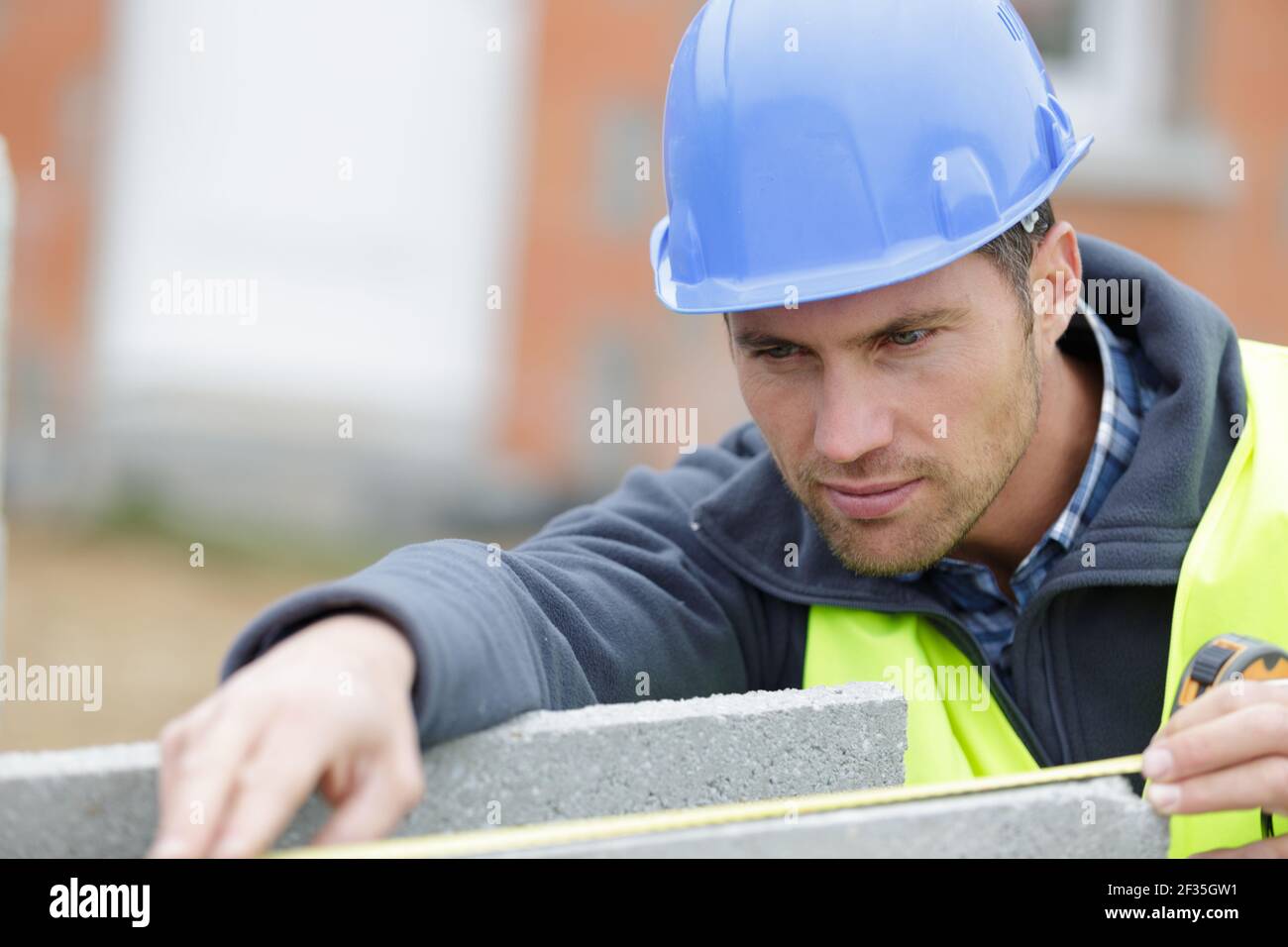 construction worker with cement block Stock Photo - Alamy