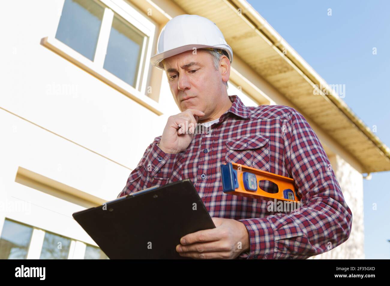 construction mason worker checking clipboard outdoors Stock Photo - Alamy construction mason worker checking clipboard outdoors Stock Photo - Alamy