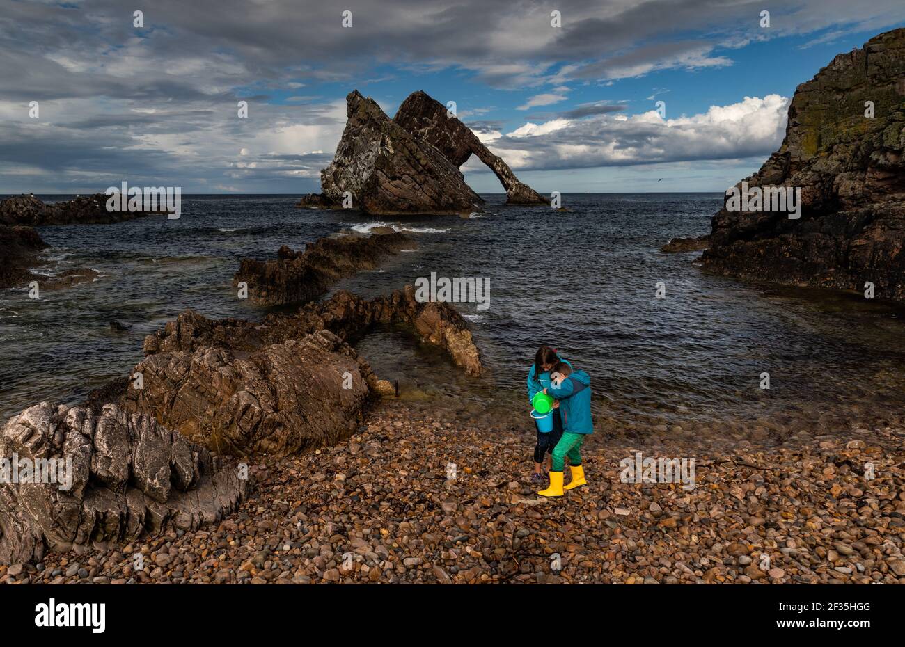 Children playing on the rocks at Bow Fiddle Rock in Portknockie ...