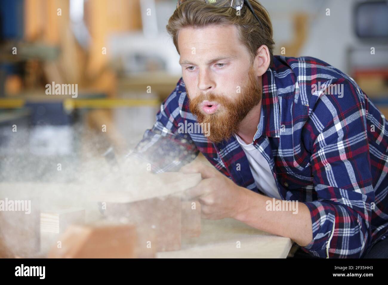 Sawdust blowing hi-res stock photography and images - Alamy