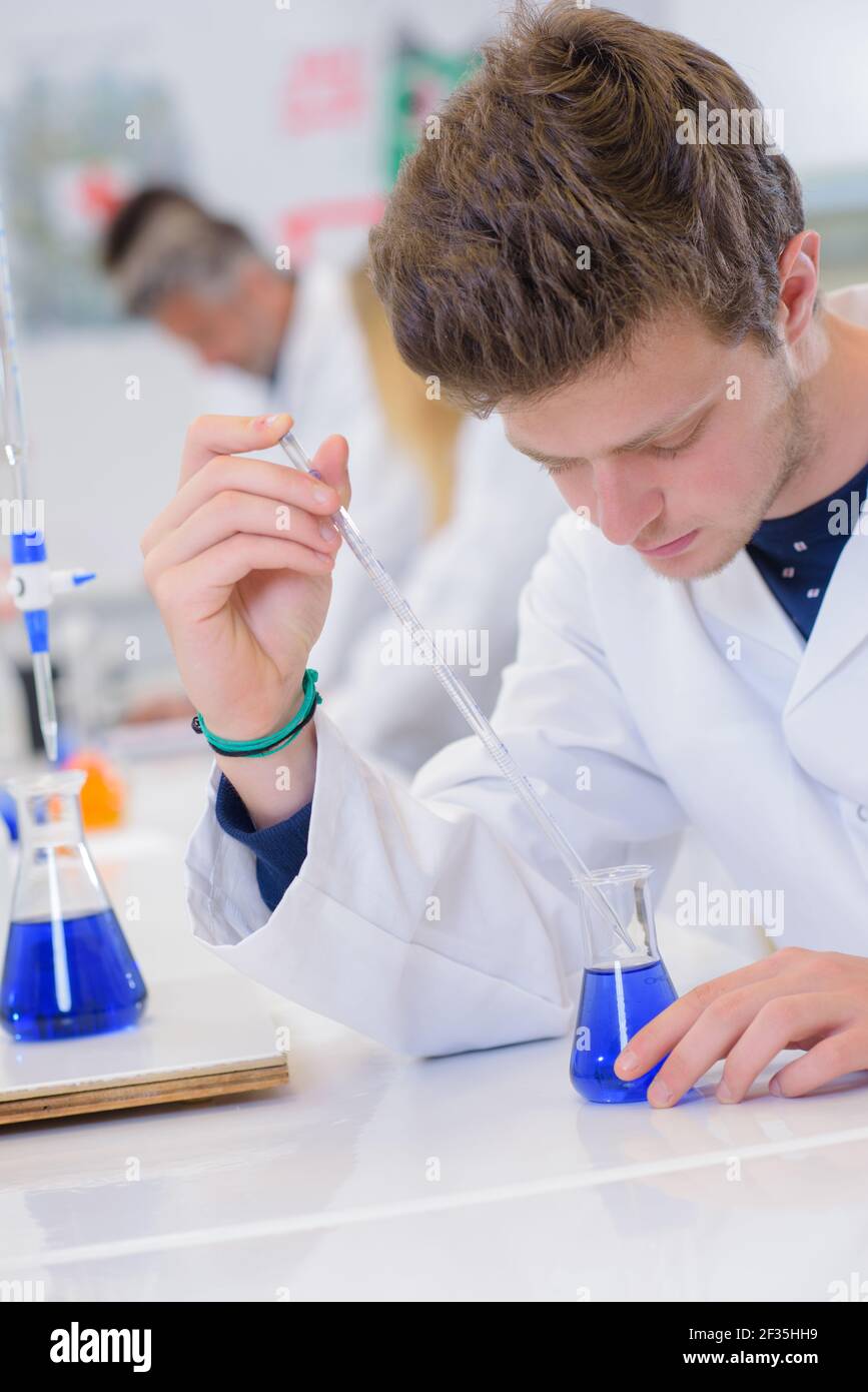 student and teacher in laboratory Stock Photo - Alamy