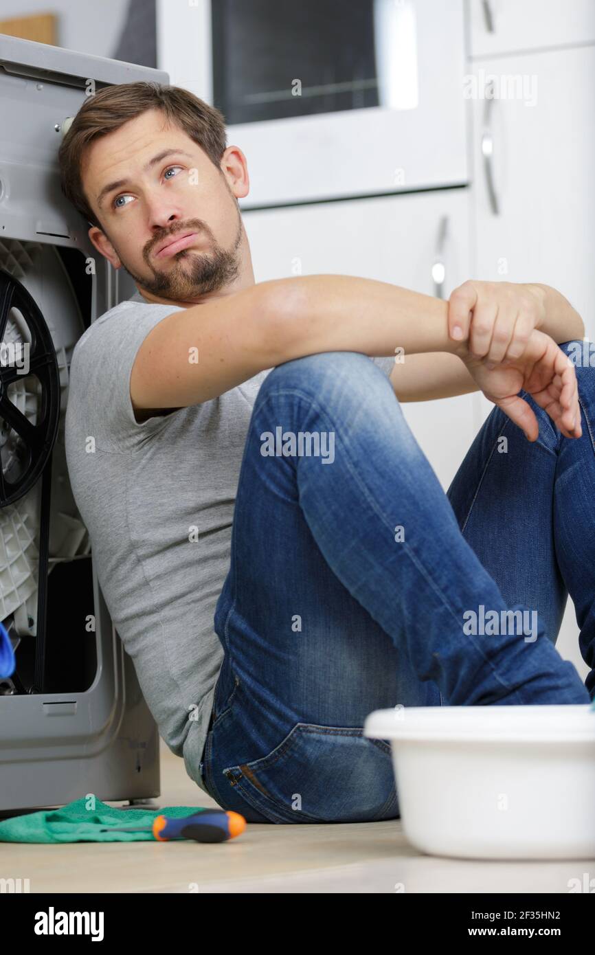Broken washing machine kitchen hi-res stock photography and images - Alamy