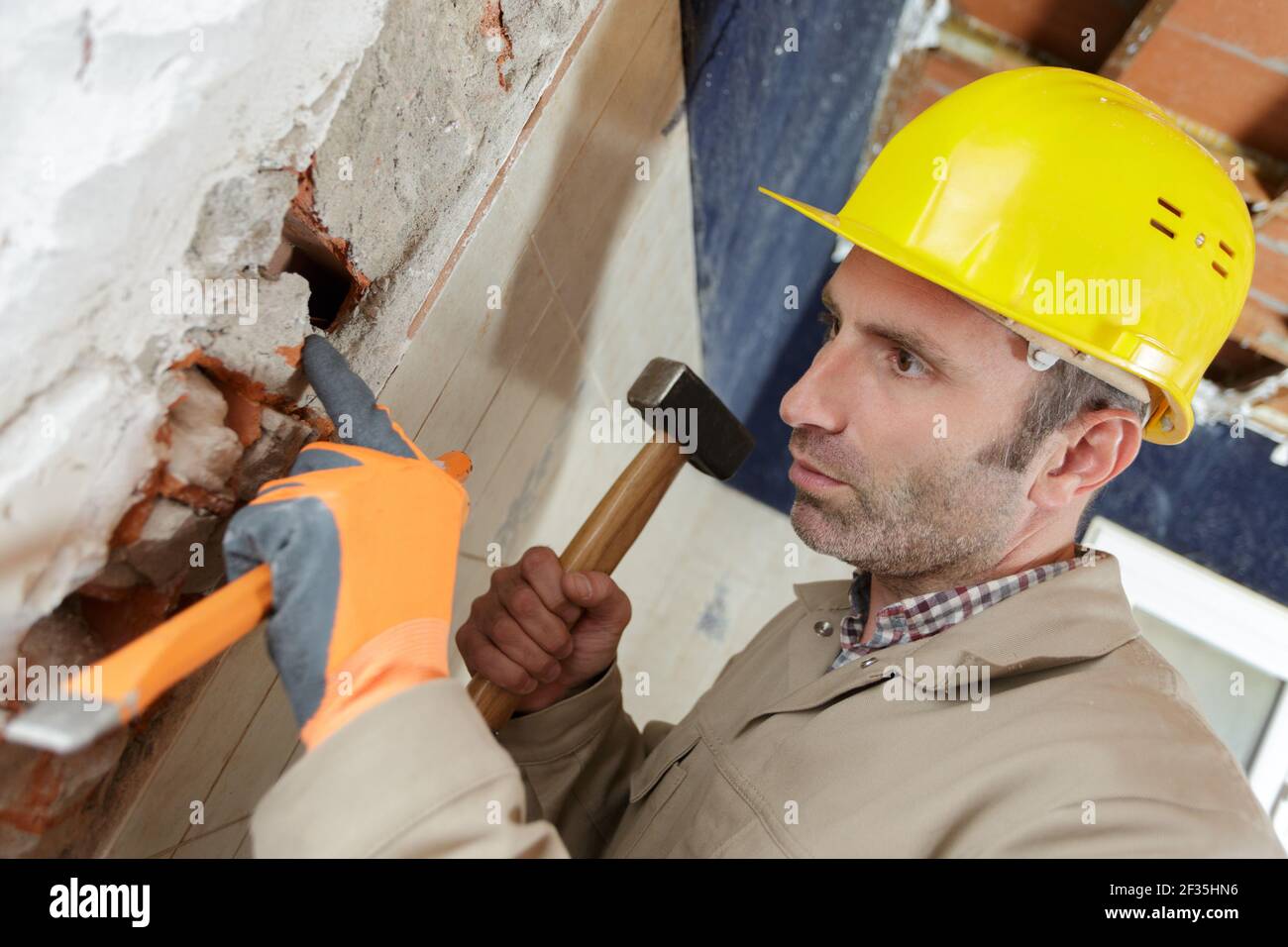 Man using chisel hammer hi-res stock photography and images - Alamy