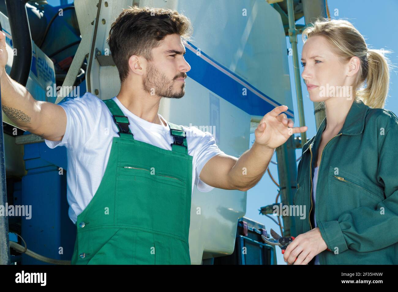 a heavy equipment and a mechanical team Stock Photo - Alamy