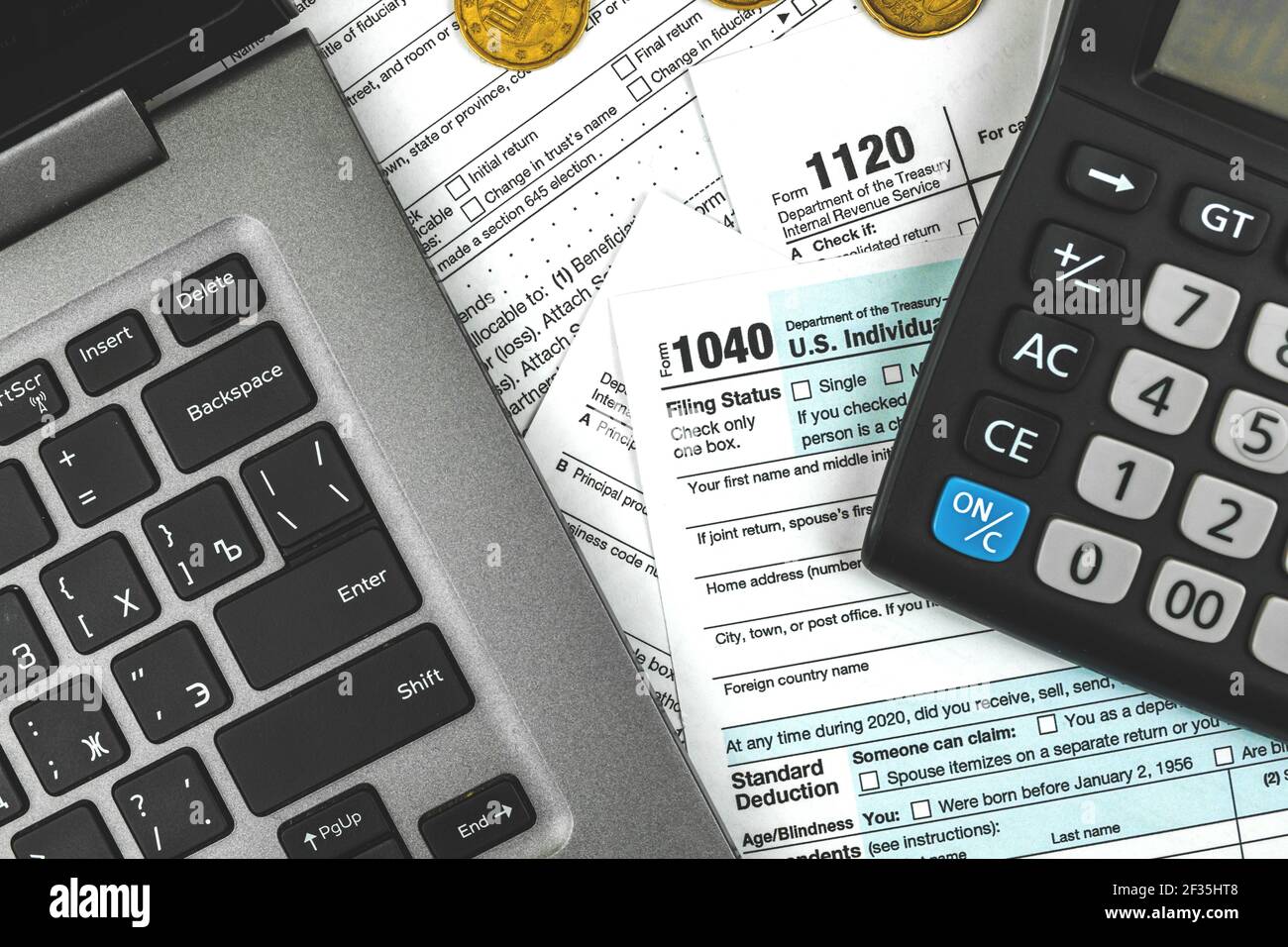 Office desk with tax forms, laptop and calculator, business concept ...