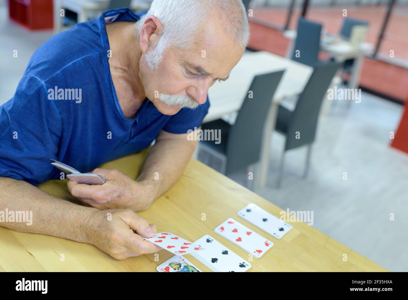 senior men playing cards outdoors Stock Photo - Alamy