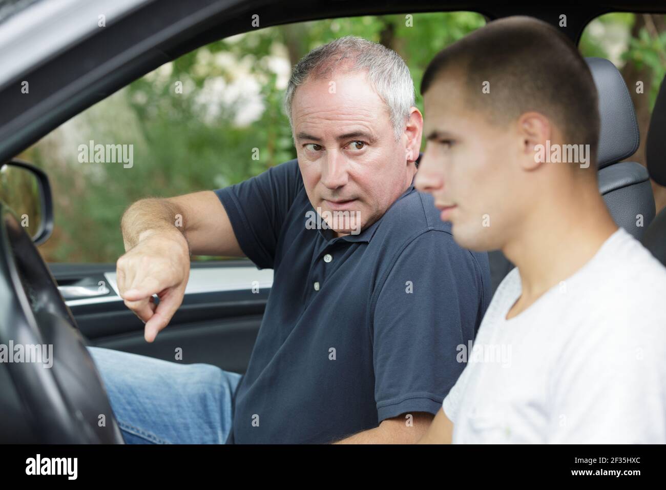 two men arguing after a car accident Stock Photo - Alamy