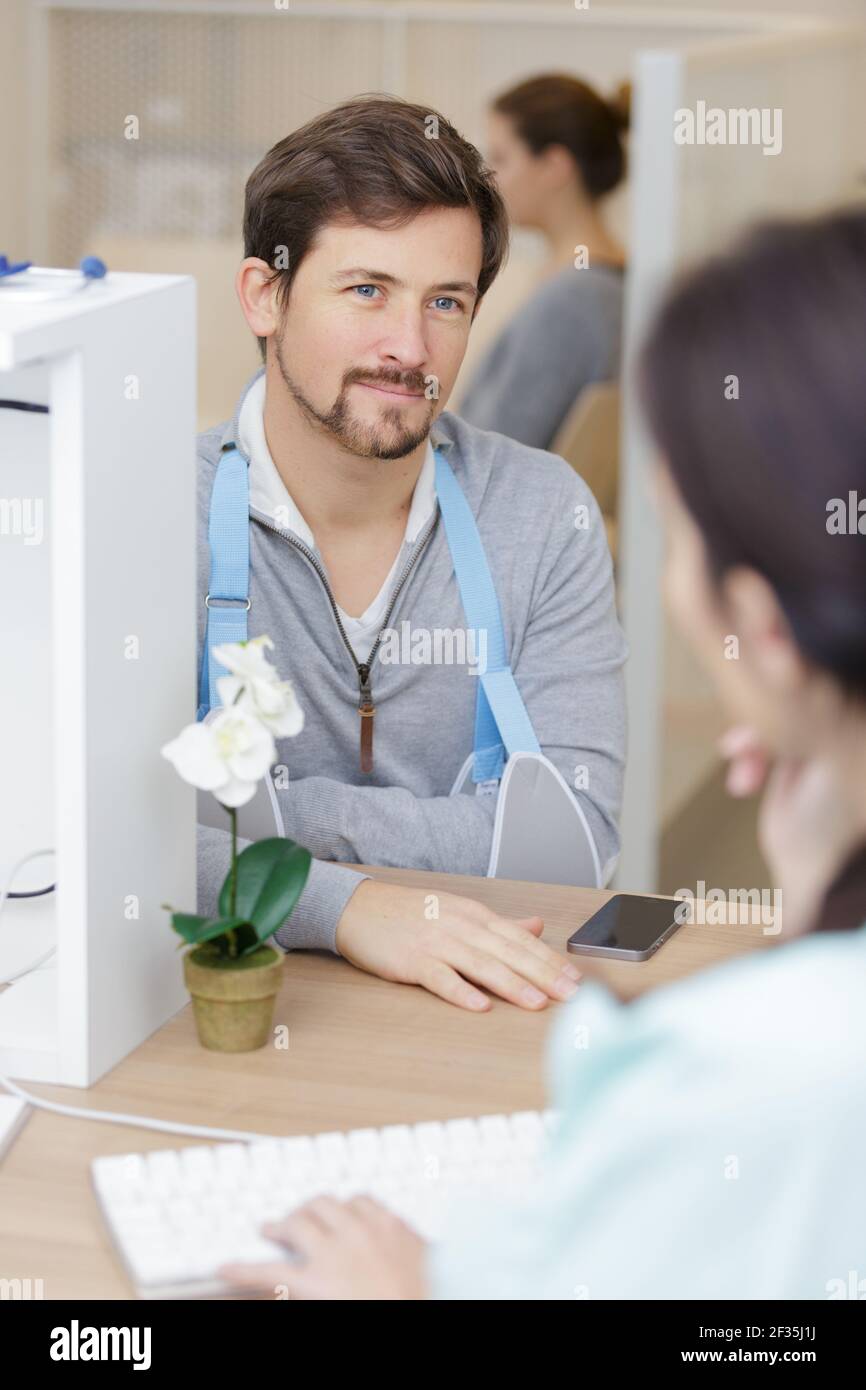a receptionist at a modern clinic Stock Photo - Alamy