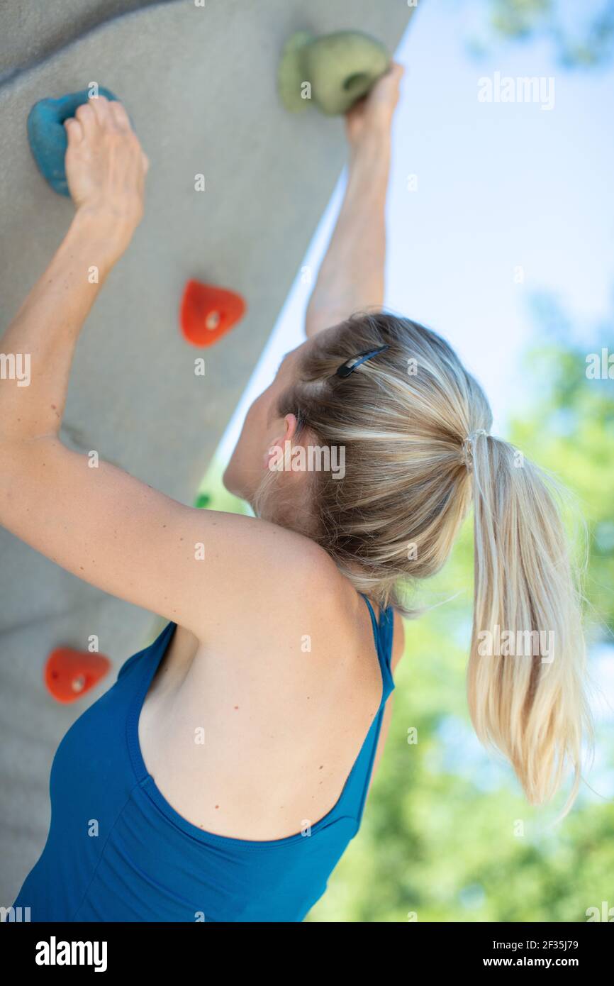 women climbing on a wall in an outdoor climbing center Stock Photo - Alamy