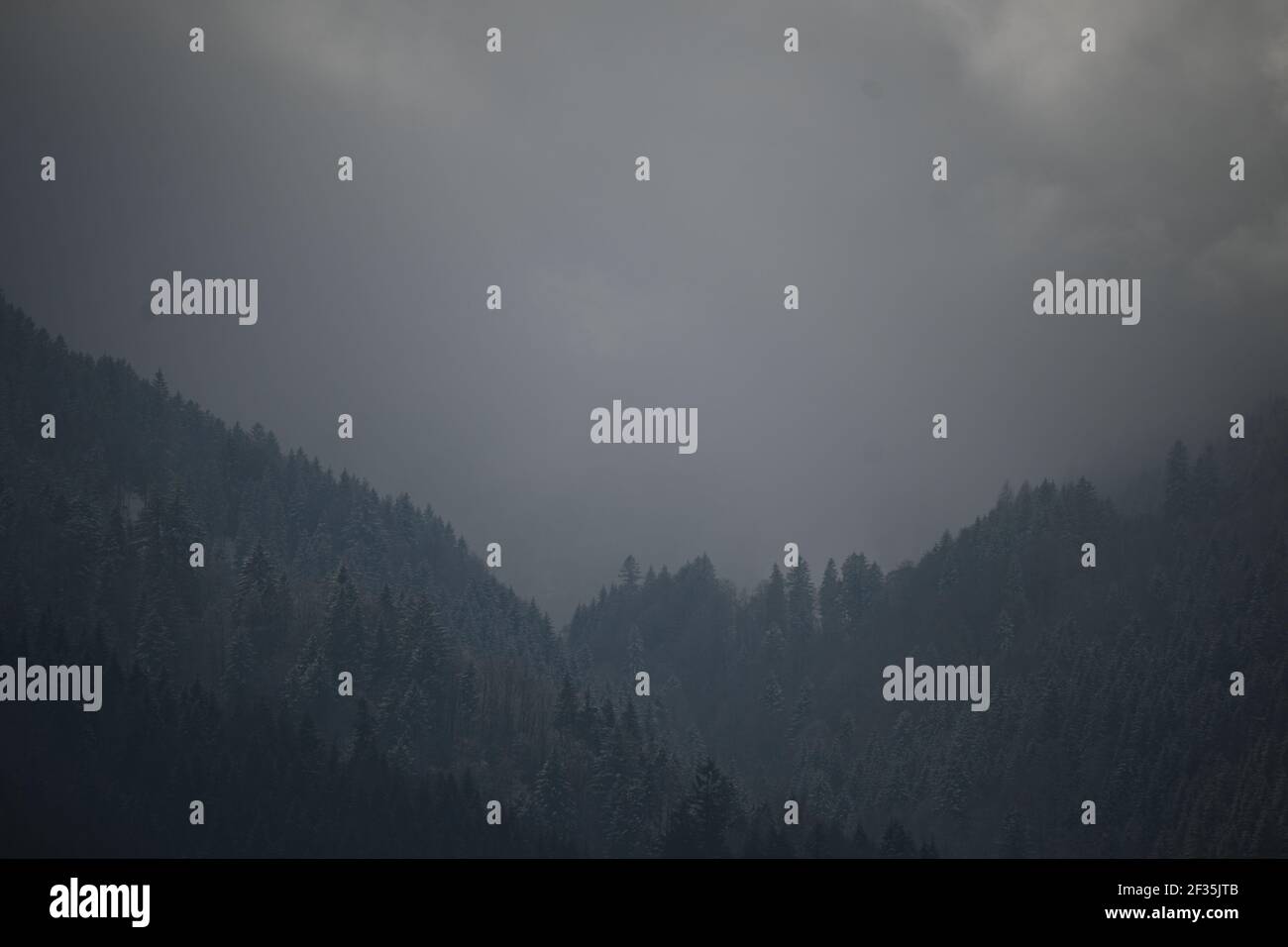 Foggy, snowy landscapes of mountains Stock Photo - Alamy