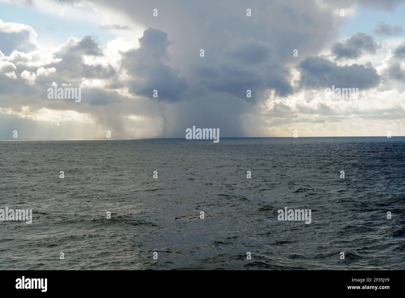 Storm over the sea with heavy rainfall clouds observed on Pacific ocean ...