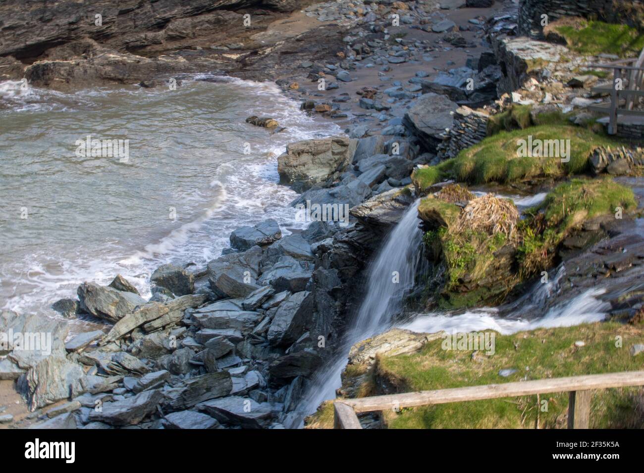 beautiful waterfall tumbling into the sea Stock Photo - Alamy