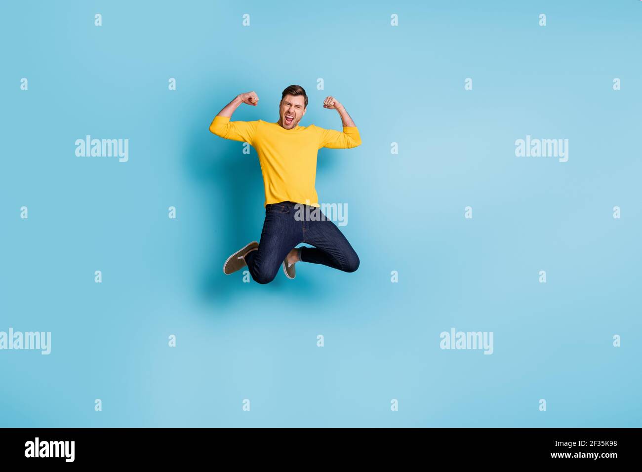 Full body portrait of astonished person jump high fists up open mouth ...