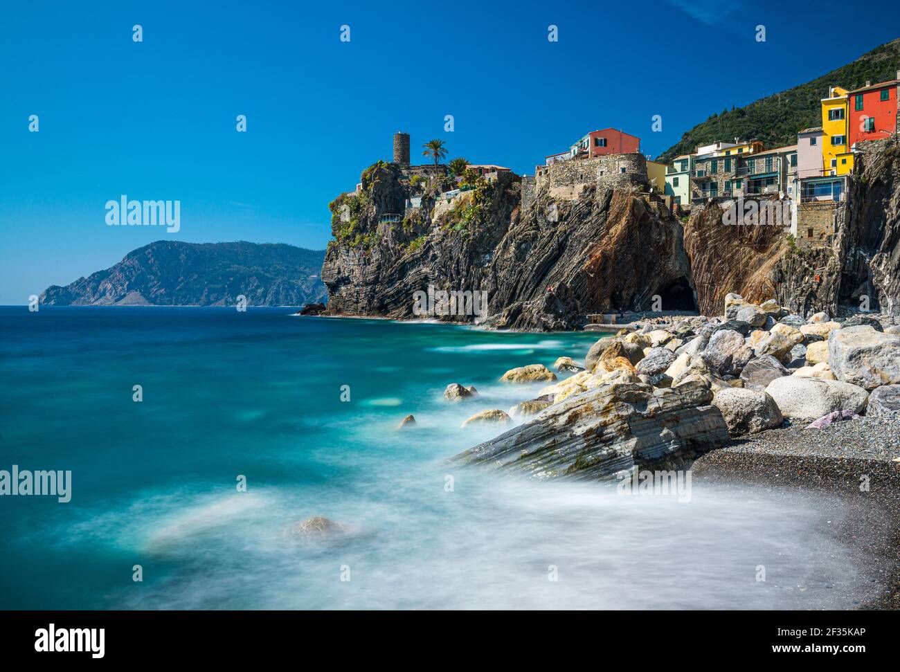 Panoramic view of sharp cliff above sea and colorful village on this ...