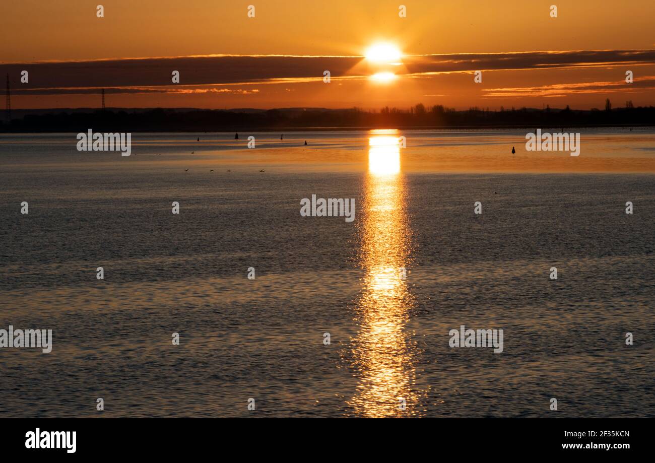 Vitte, Germany. 10th Mar, 2021. The sun rises over the coast of Rügen ...