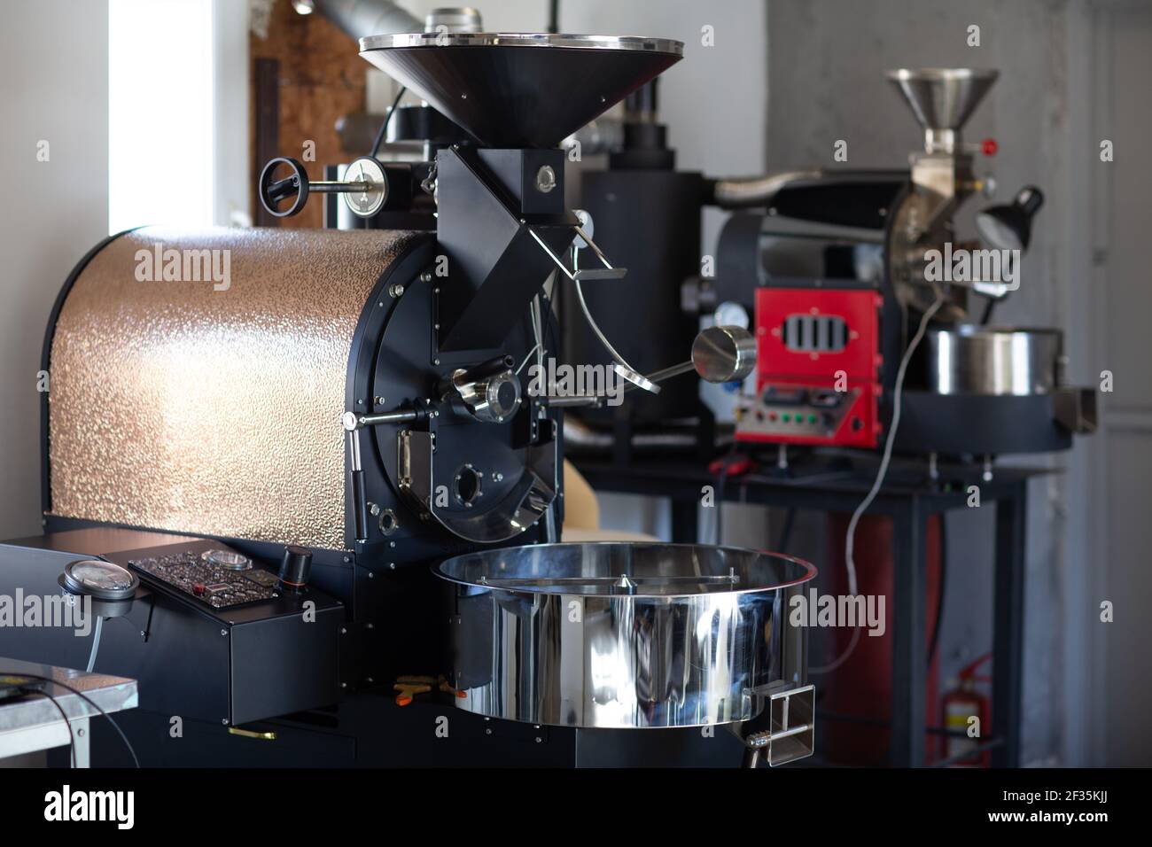 Coffee roaster machine at coffee roasting process Stock Photo - Alamy